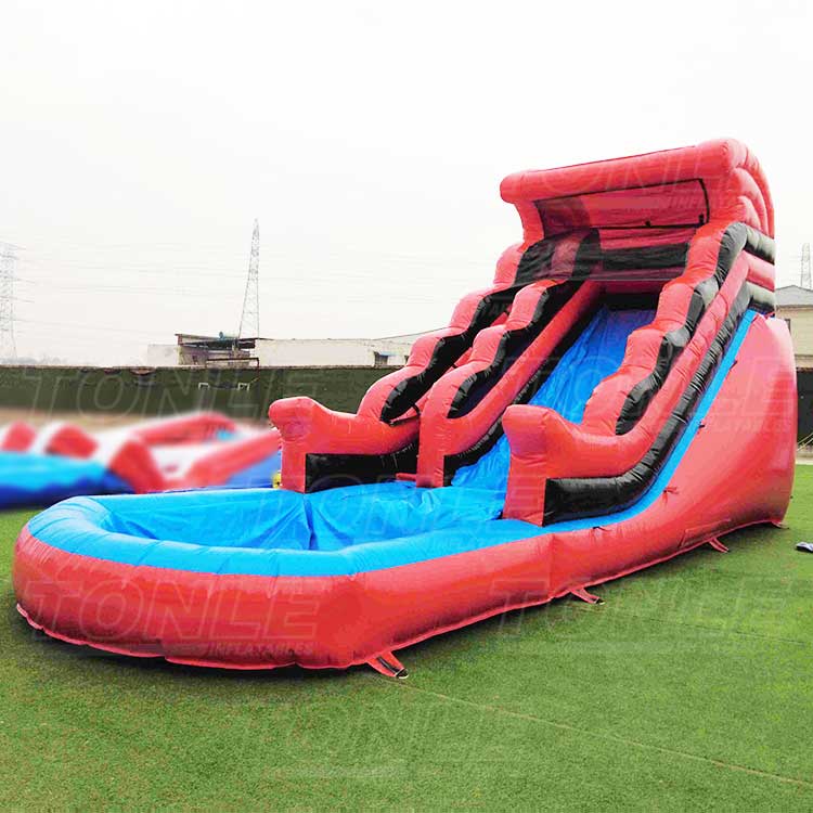 red inflatable water slide with pool